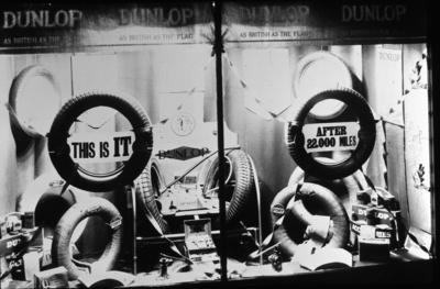 Shop window display showing Dunlop tyres - Falkirk Council