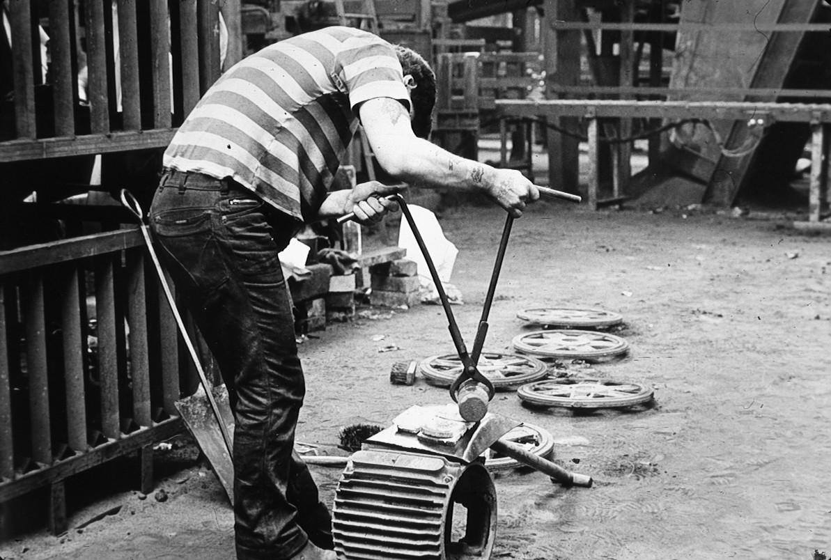 Moulder moulding at Torwood Foundry, Larbert - Falkirk Council